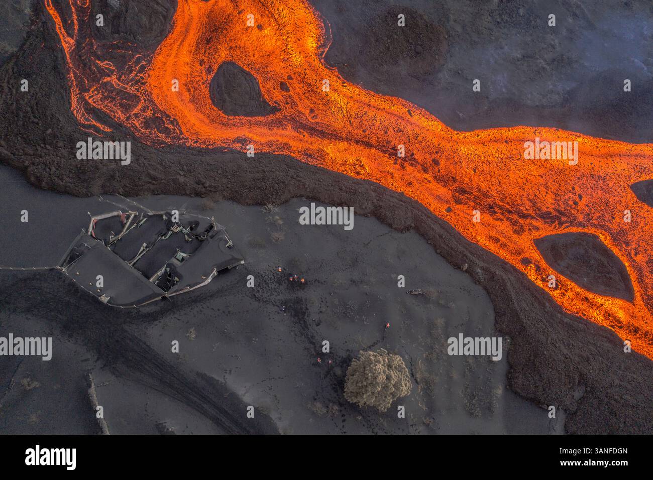Aerial top down view of lava floating down the Volcan Cumbre Vieja, a ...