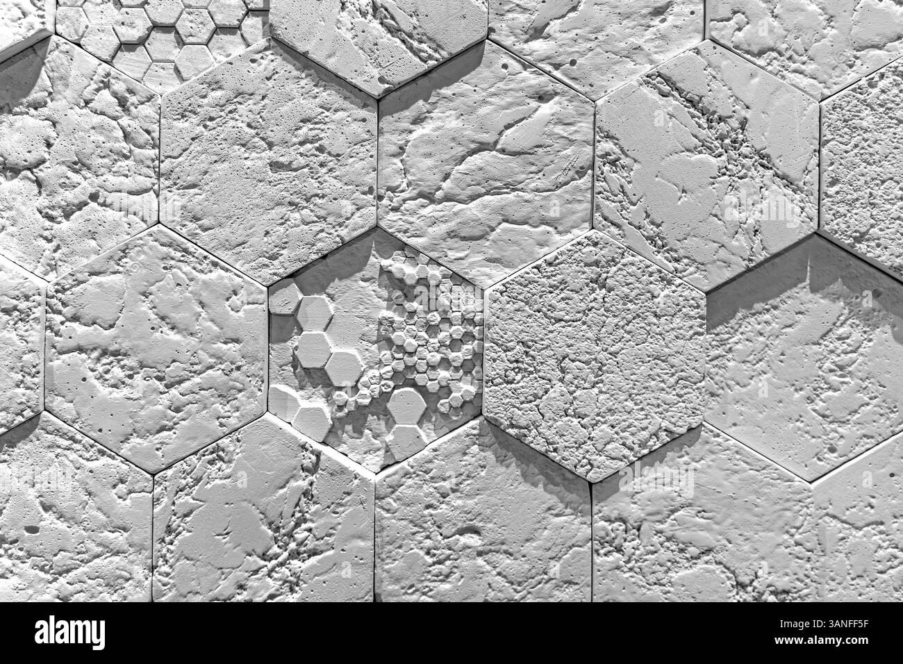 Textured white hexagonal wall tile pattern. Modern white wall made of hexagonal tiles with ...