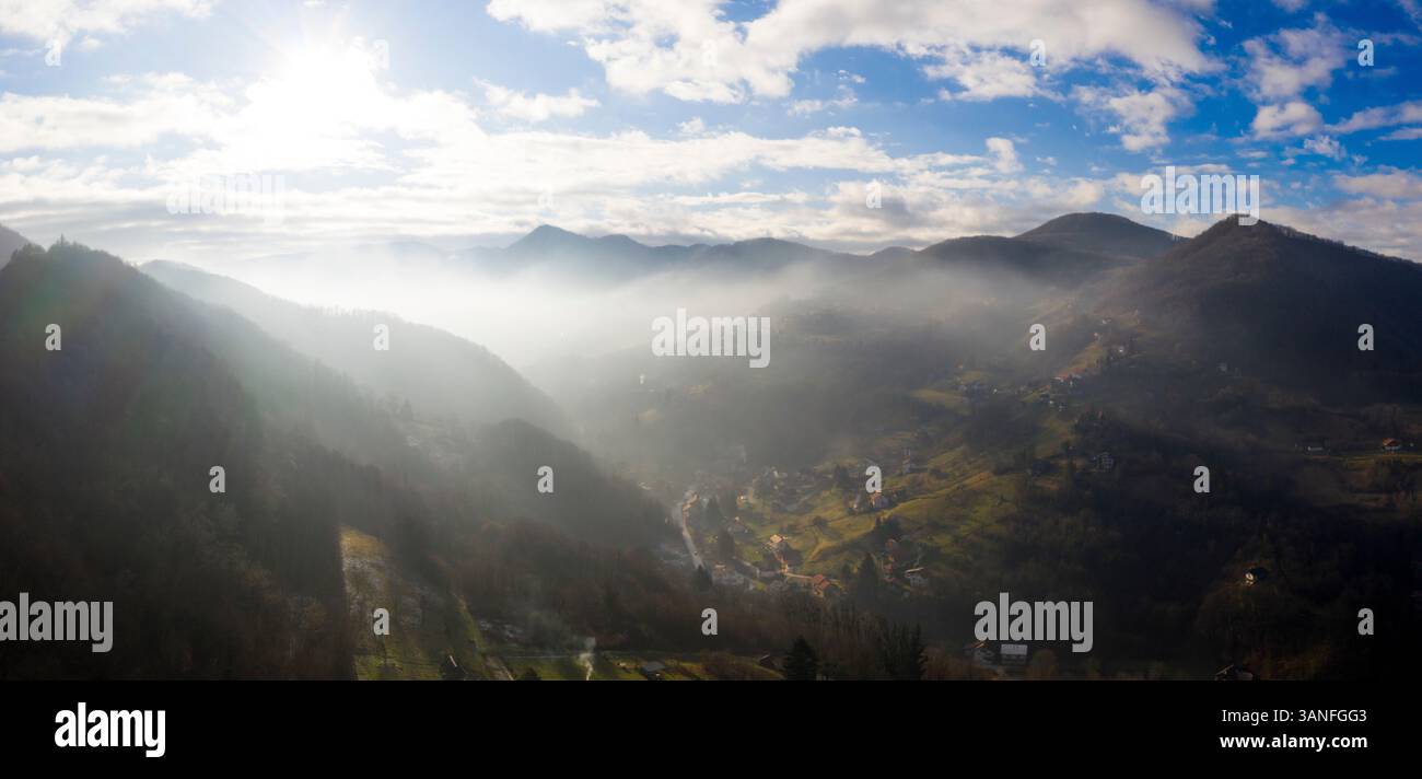 Aerial view of scenic sunset over village at Zumberak mountain range ...