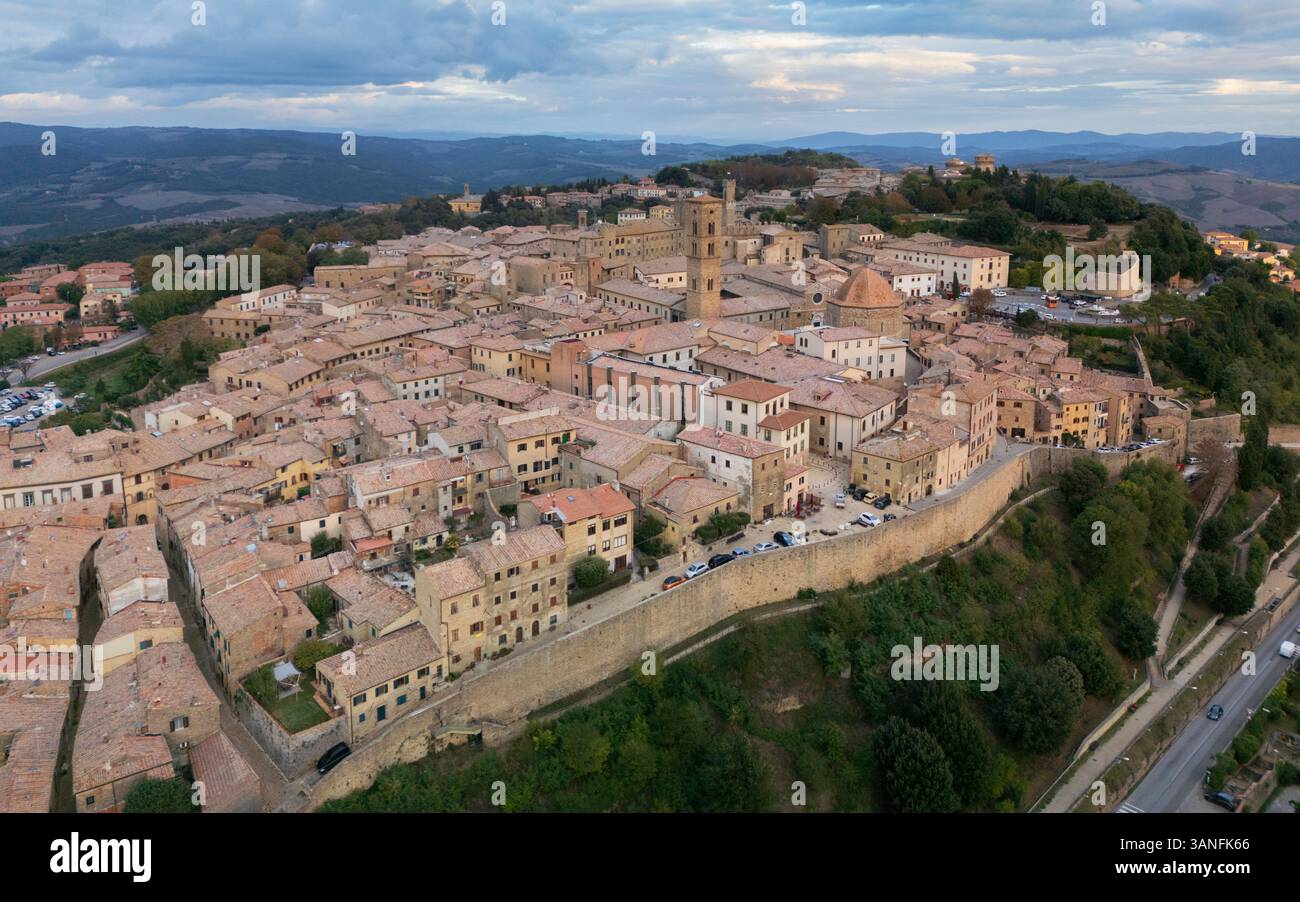 Aerial view of the walled city with the Cathedral of Volterra and ...