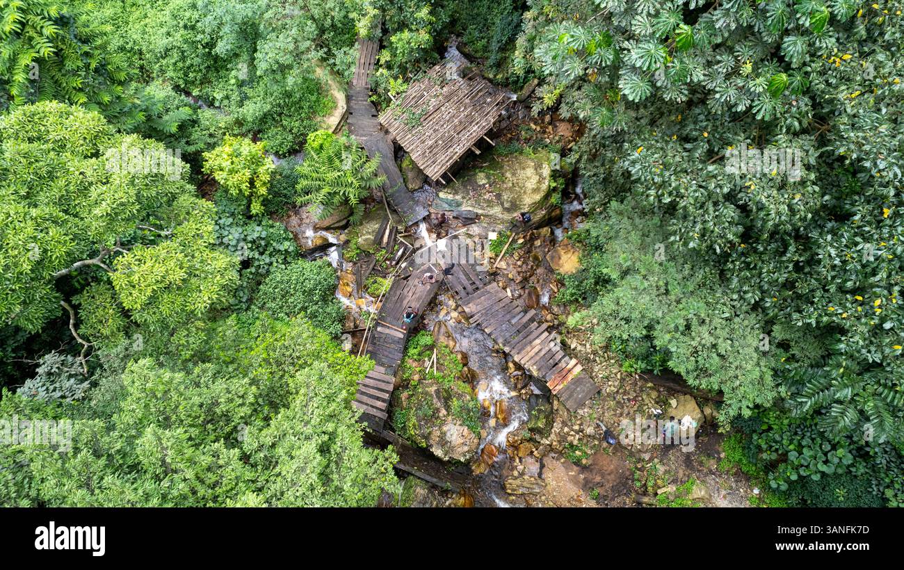 Aerial view of arinta waterfall surrounded by lush greenery and a ...