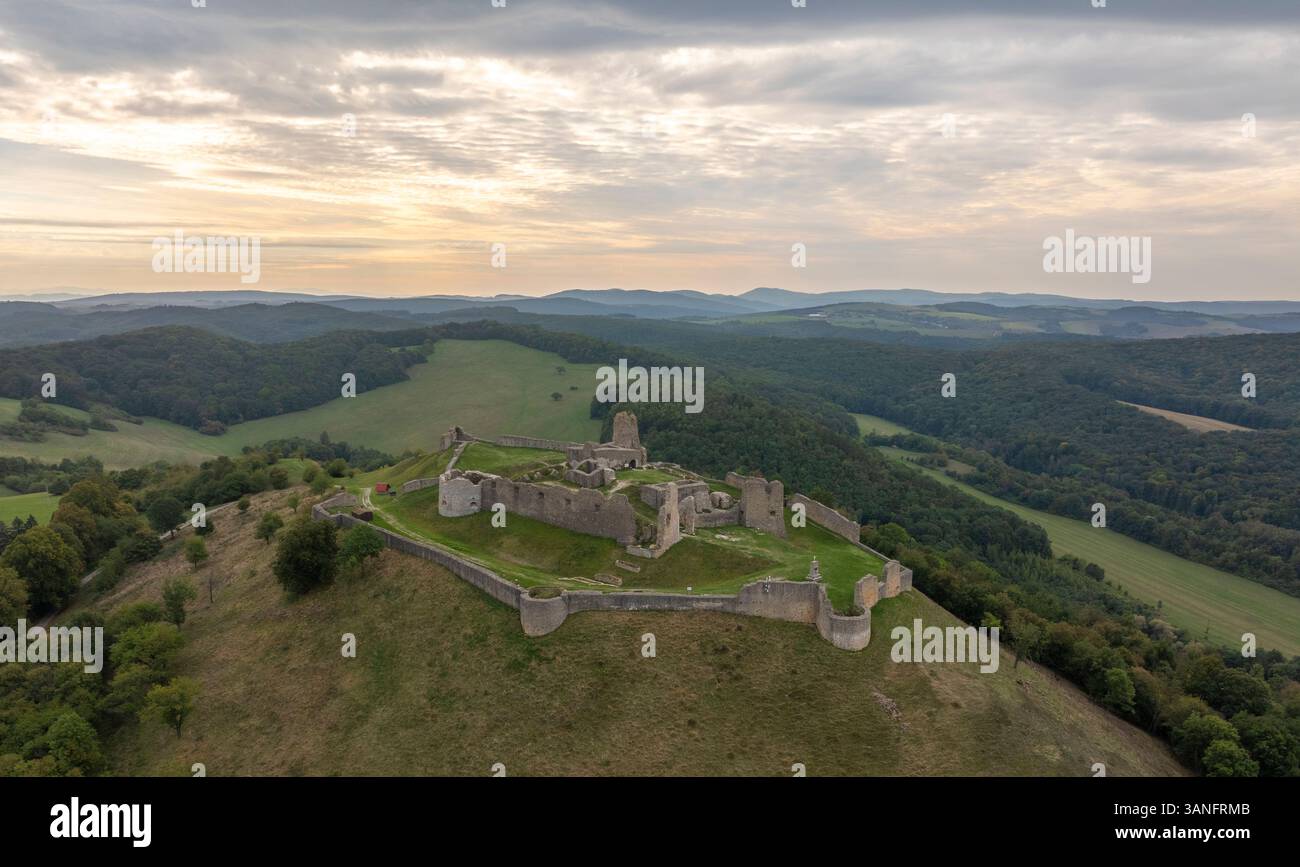Aerial view of the historic Branc castle ruin on a hilltop surrounded ...