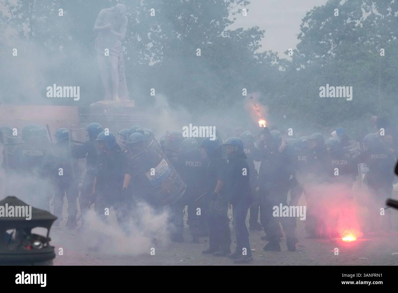 Lazio fans clash with Italian Policemen in riot gear outside the ...