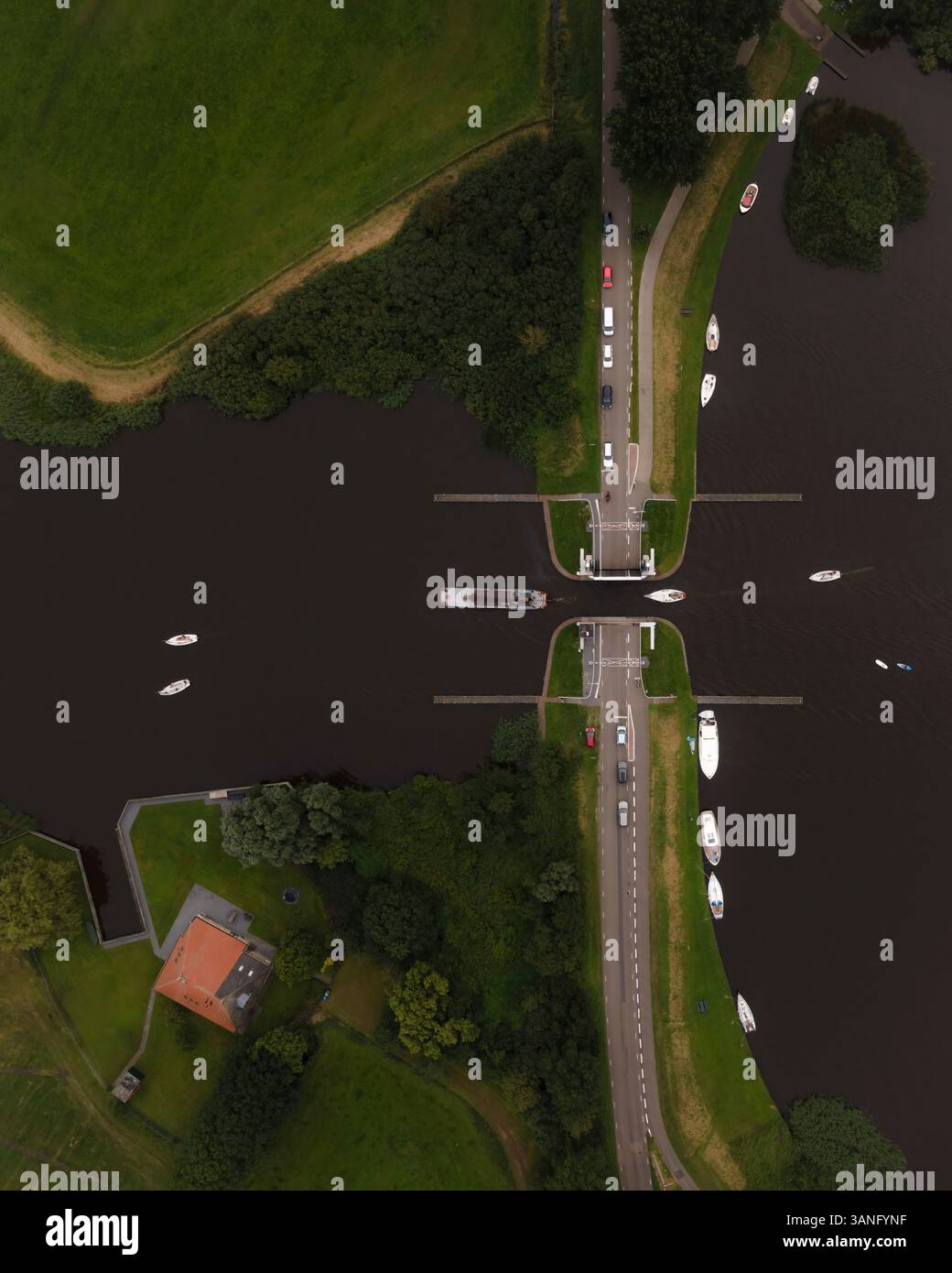 Aerial view of serene Sneekermeer lake with boats and a bridge in a ...