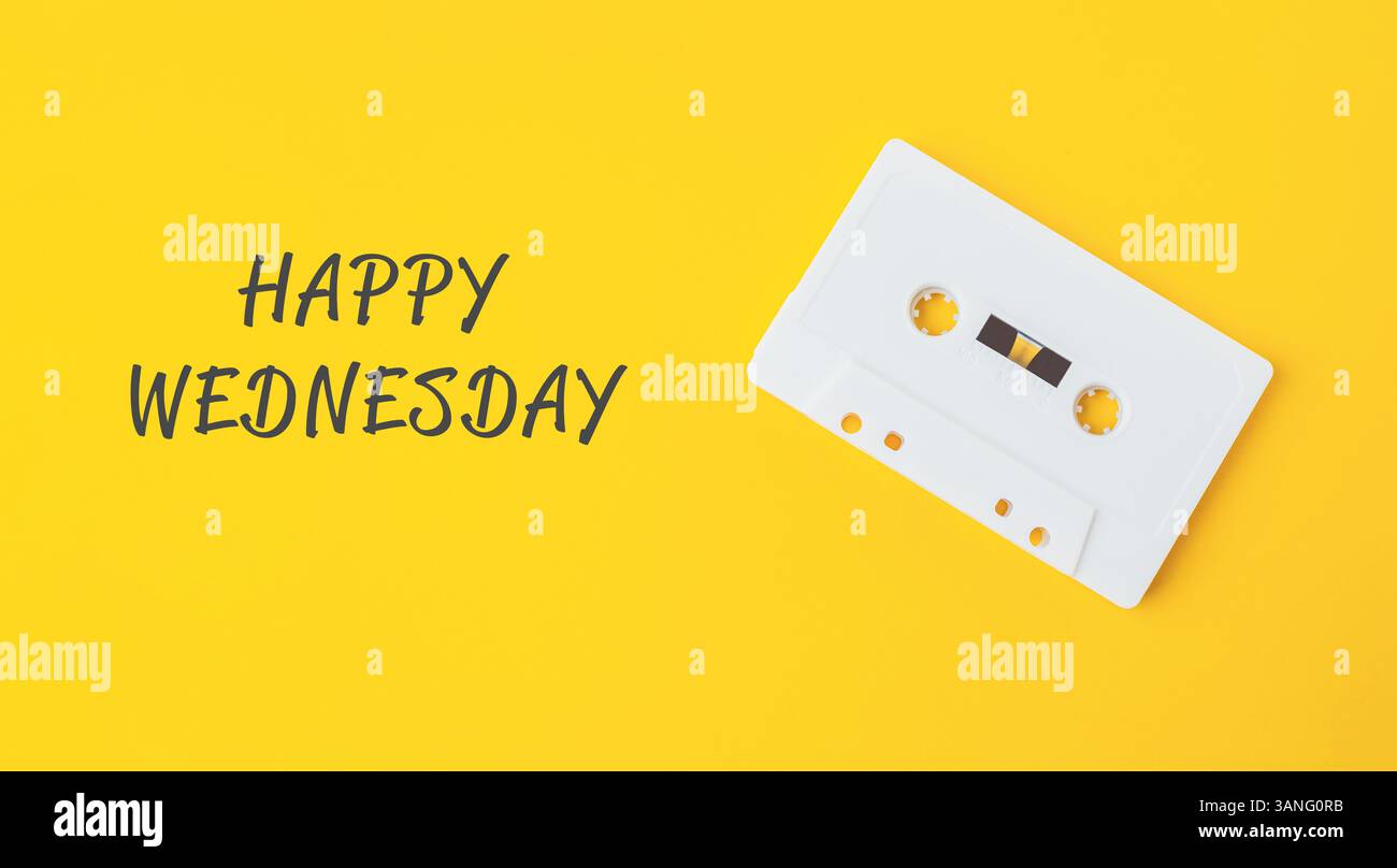 White cassette tape is on a yellow background with the words Happy ...