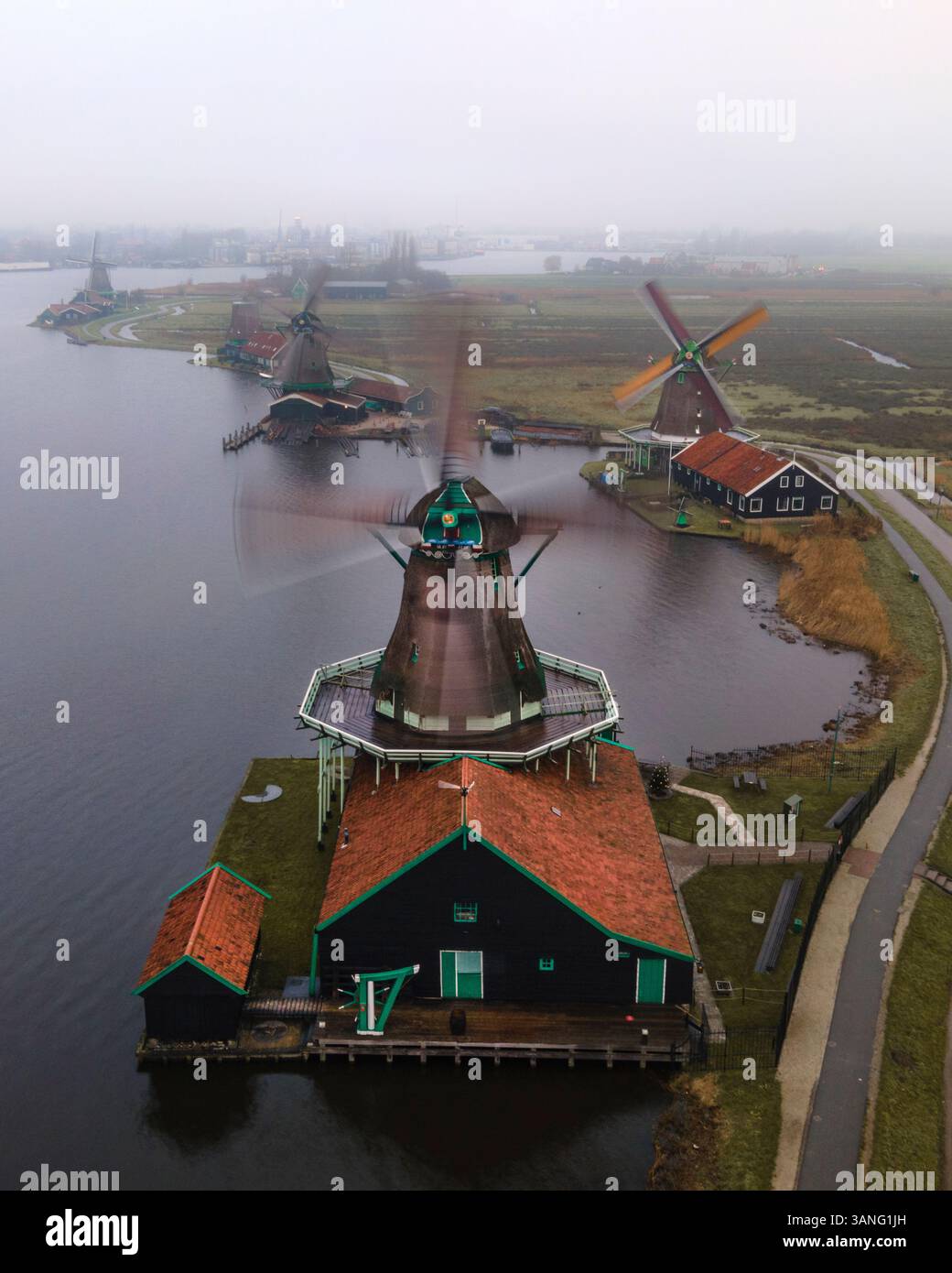 Aerial view of traditional windmills and picturesque buildings by the ...