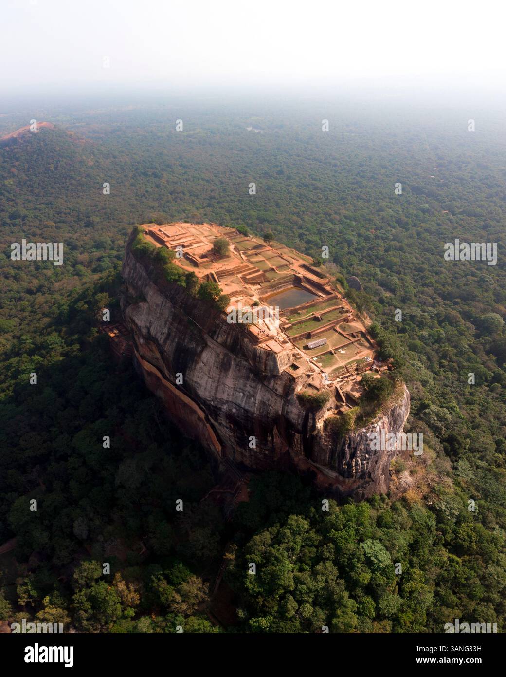 Aerial view of the ancient lion rock fortress surrounded by lush ...