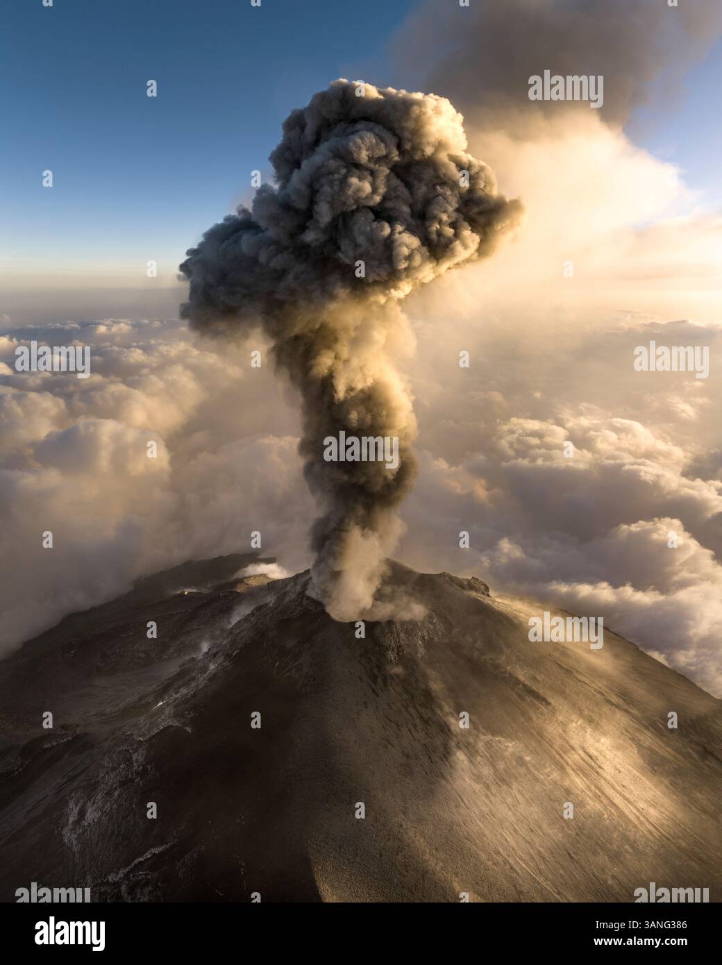 Aerial view of erupting Fuego volcano with smoke and clouds above the ...