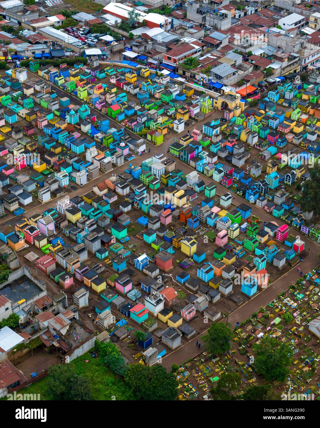Aerial view of a colorful cemetery with gravestones and tombs amidst ...