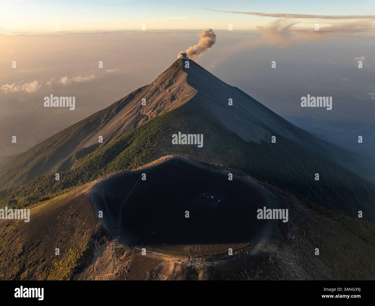 Aerial view of erupting Volcano Fuego with smoke plume and crater ...