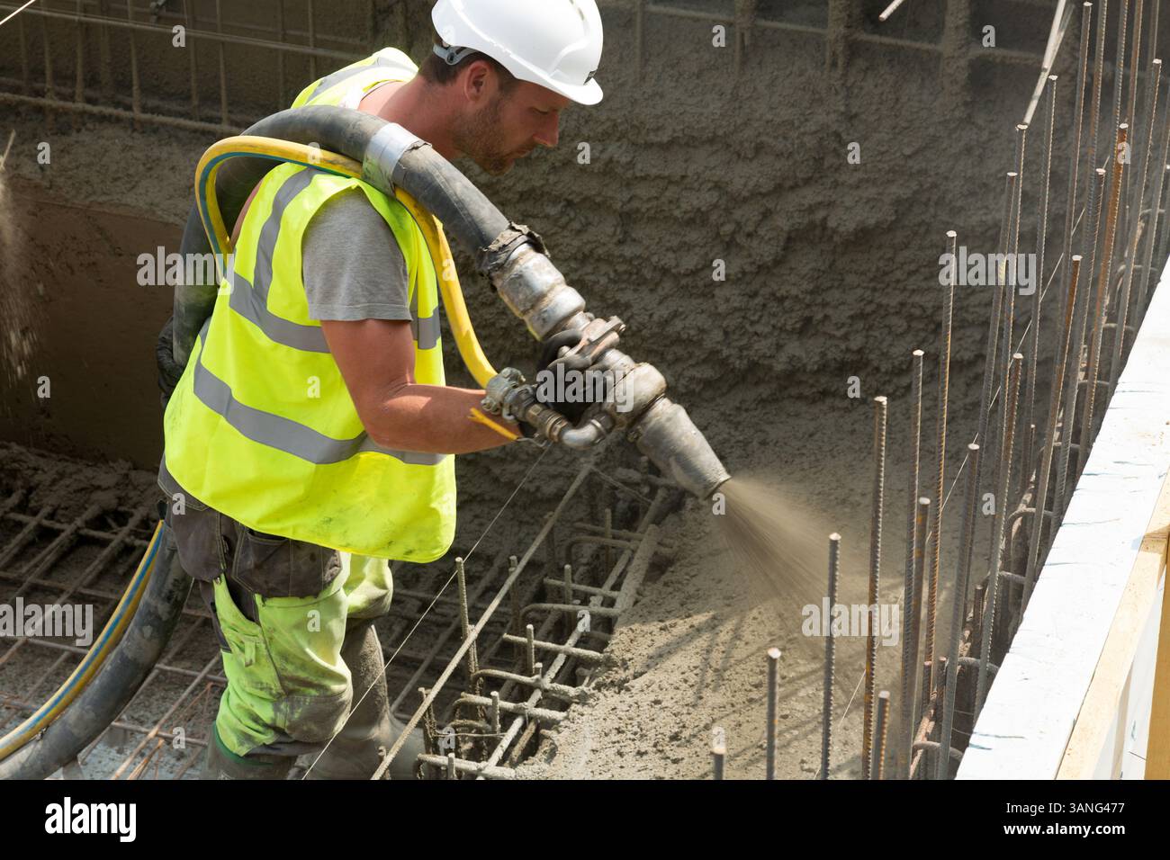 Concrete spraying in building constructiom Stock Photo - Alamy