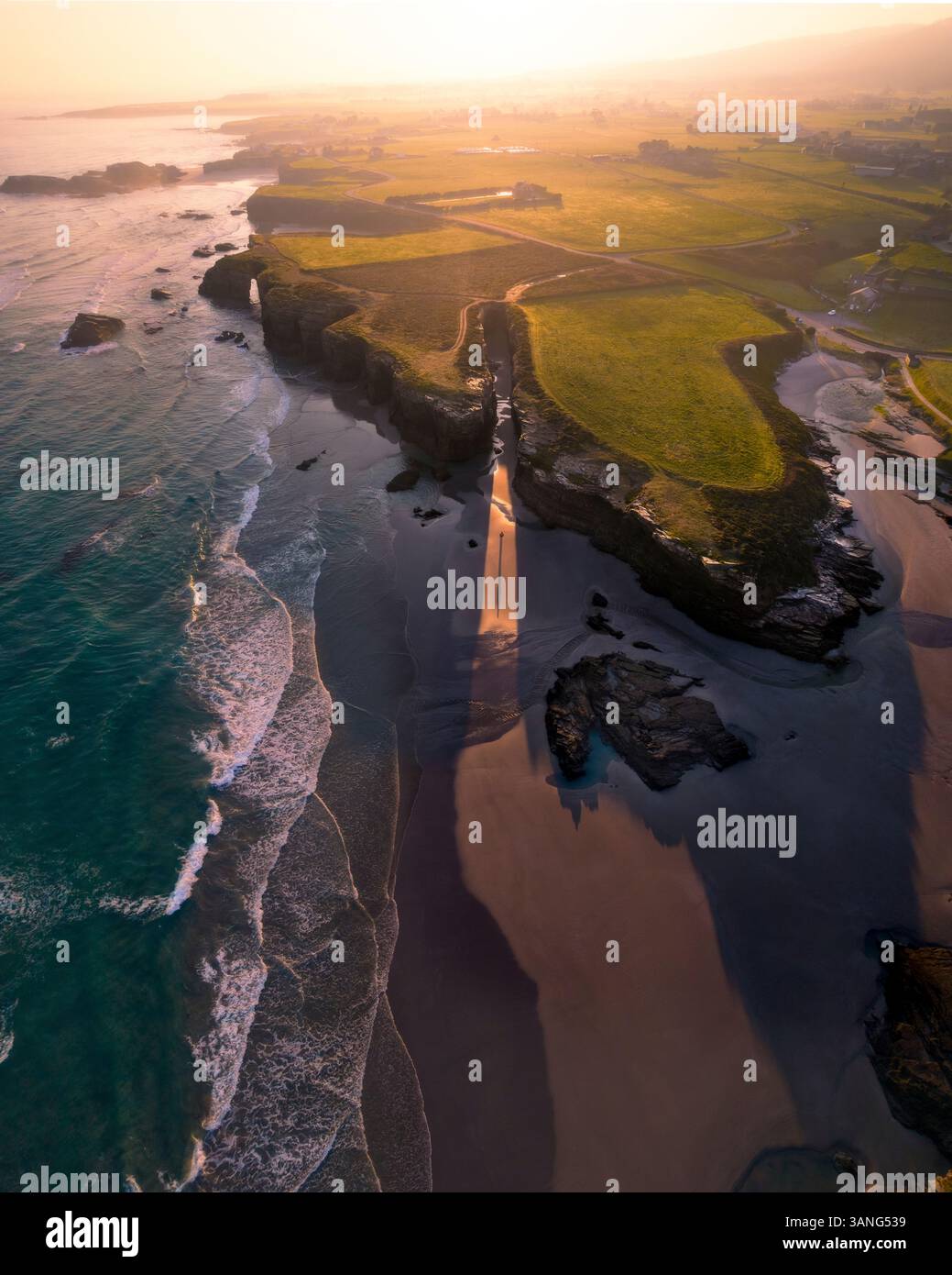 Aerial view of Praia das Catedrais beach with rugged cliffs and serene ...