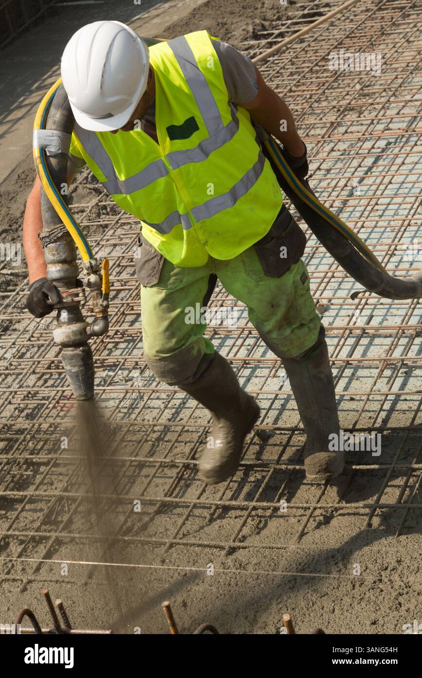 Concrete spraying in building constructiom Stock Photo - Alamy
