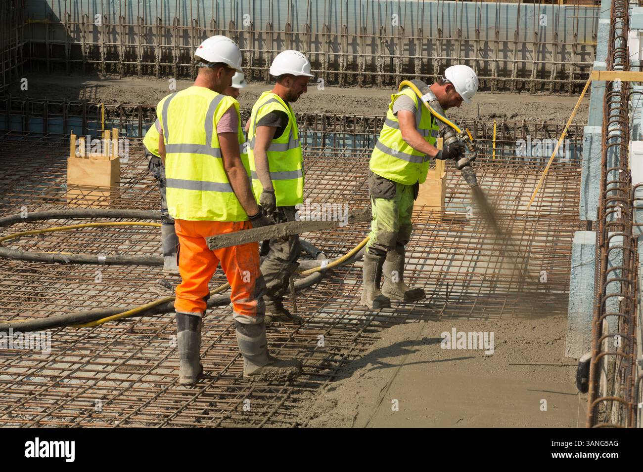 Concrete spraying in building constructiom Stock Photo - Alamy