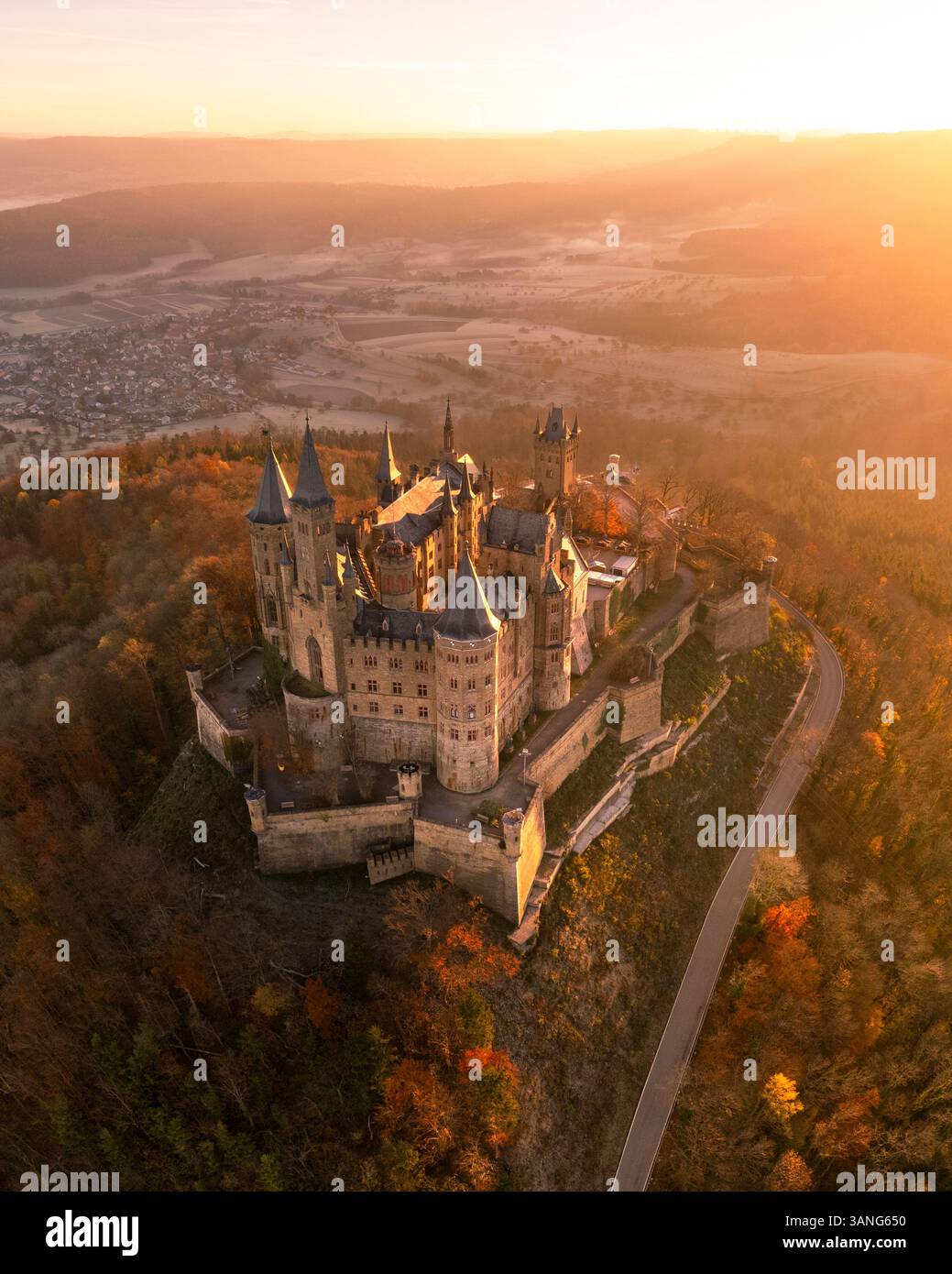 Aerial view of hohenzollern castle surrounded by colorful autumn ...
