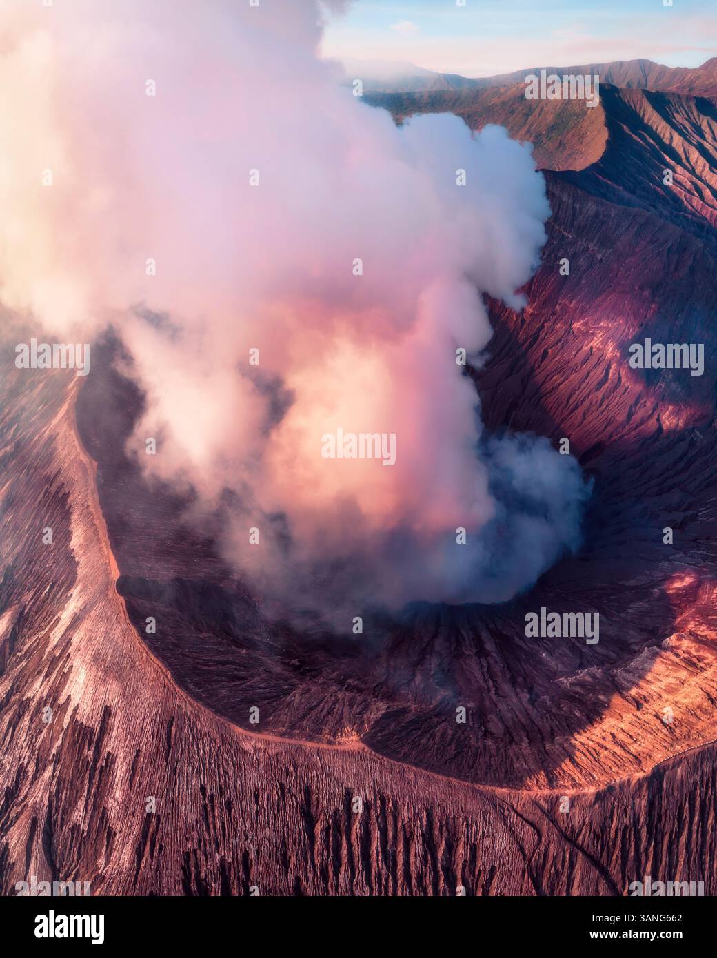 Aerial view of the majestic Bromo volcano with smoke and eruption at ...