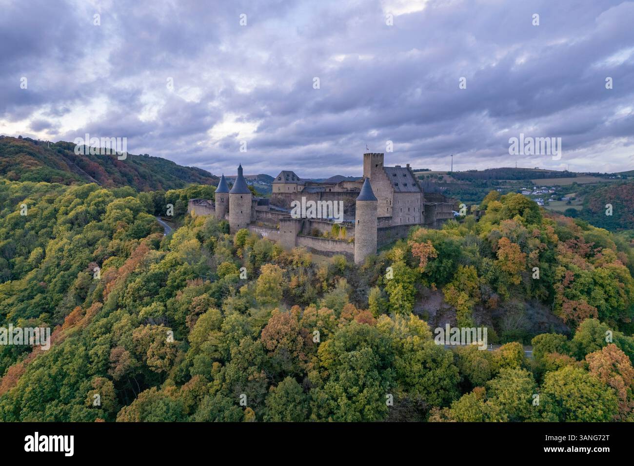 Aerial drone view of Bourscheid castle on forest hill top with ...