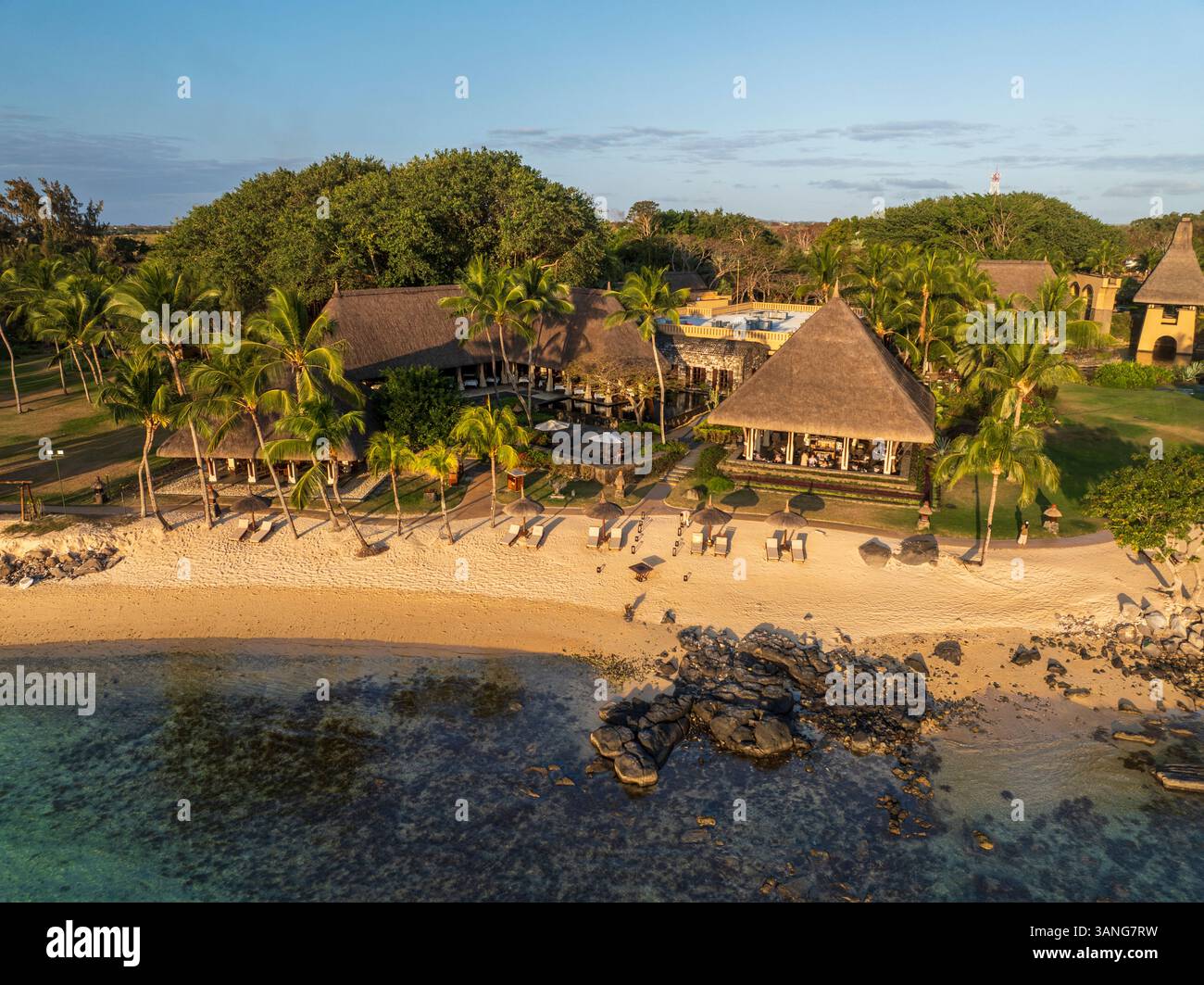 Aerial view of oberoi beach with luxury resort and palm trees, Triolet ...