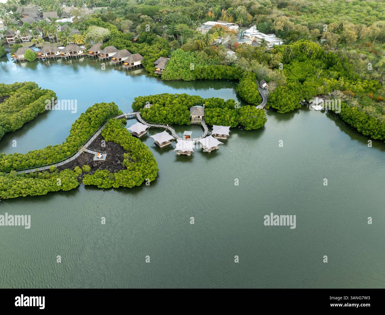 Aerial view of luxurious resort surrounded by serene lagoon and ...