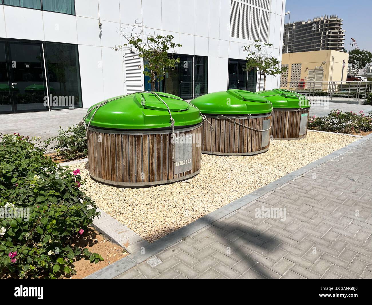 Row of modern eco-friendly waste bins. Waste management systems ...