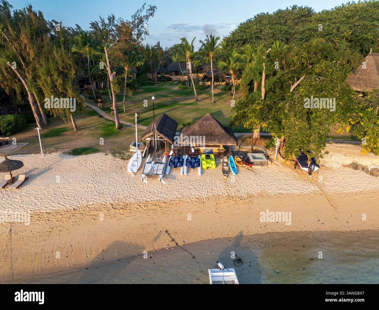 Aerial view of oberoi beach with tropical trees and serene ocean ...