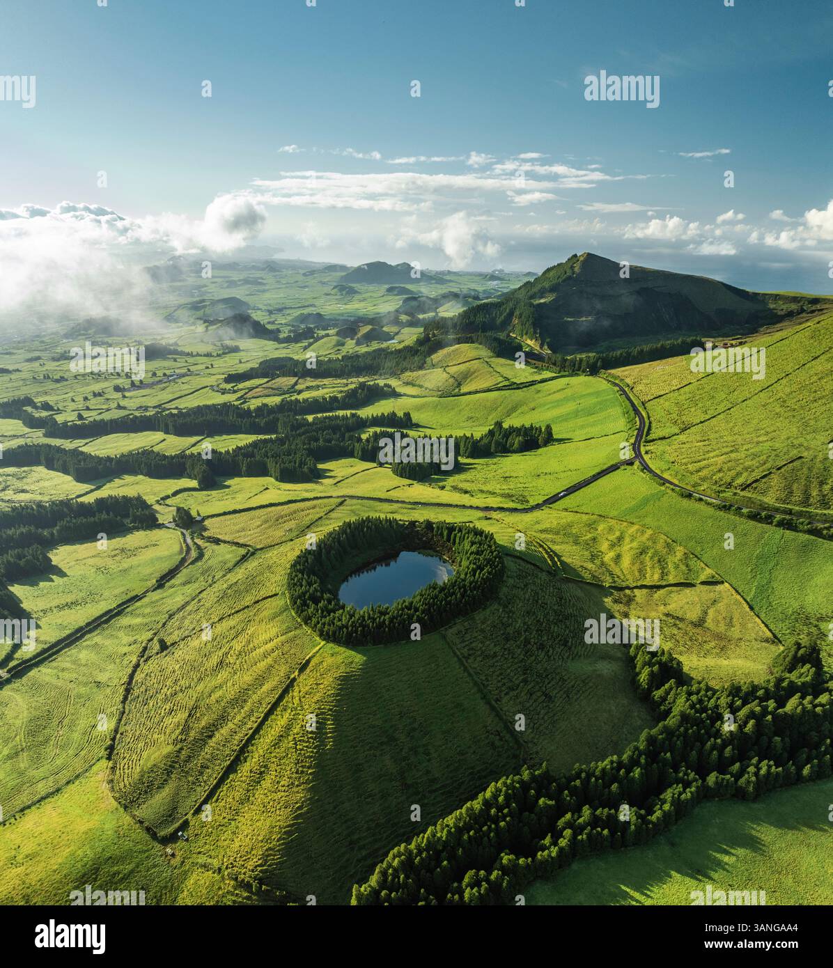 Aerial view of lush green hills and valleys surrounding Seven Lakes ...