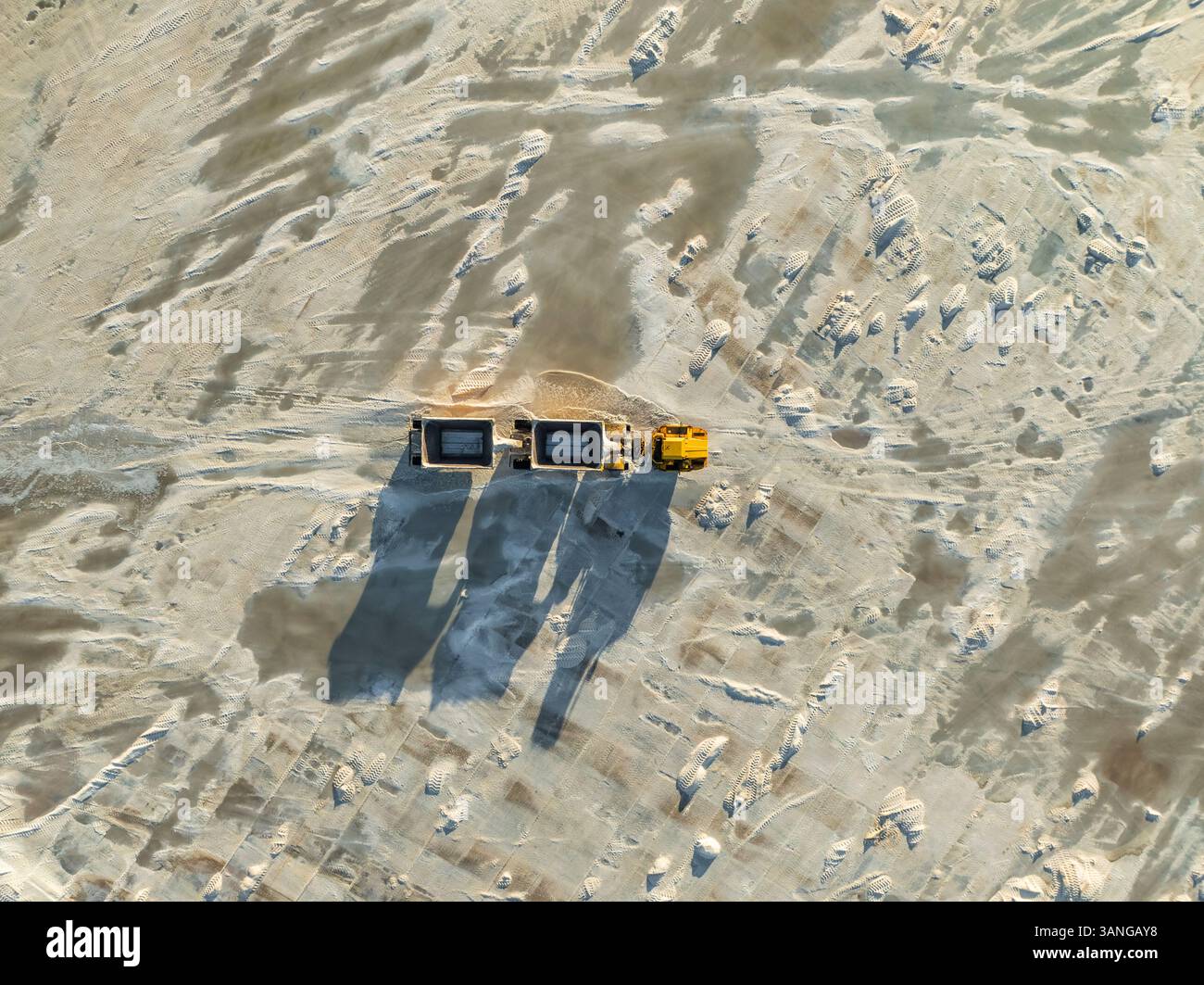 Aerial view of Pink Lake with heavy duty truck, Walvis Bay, Namibia ...