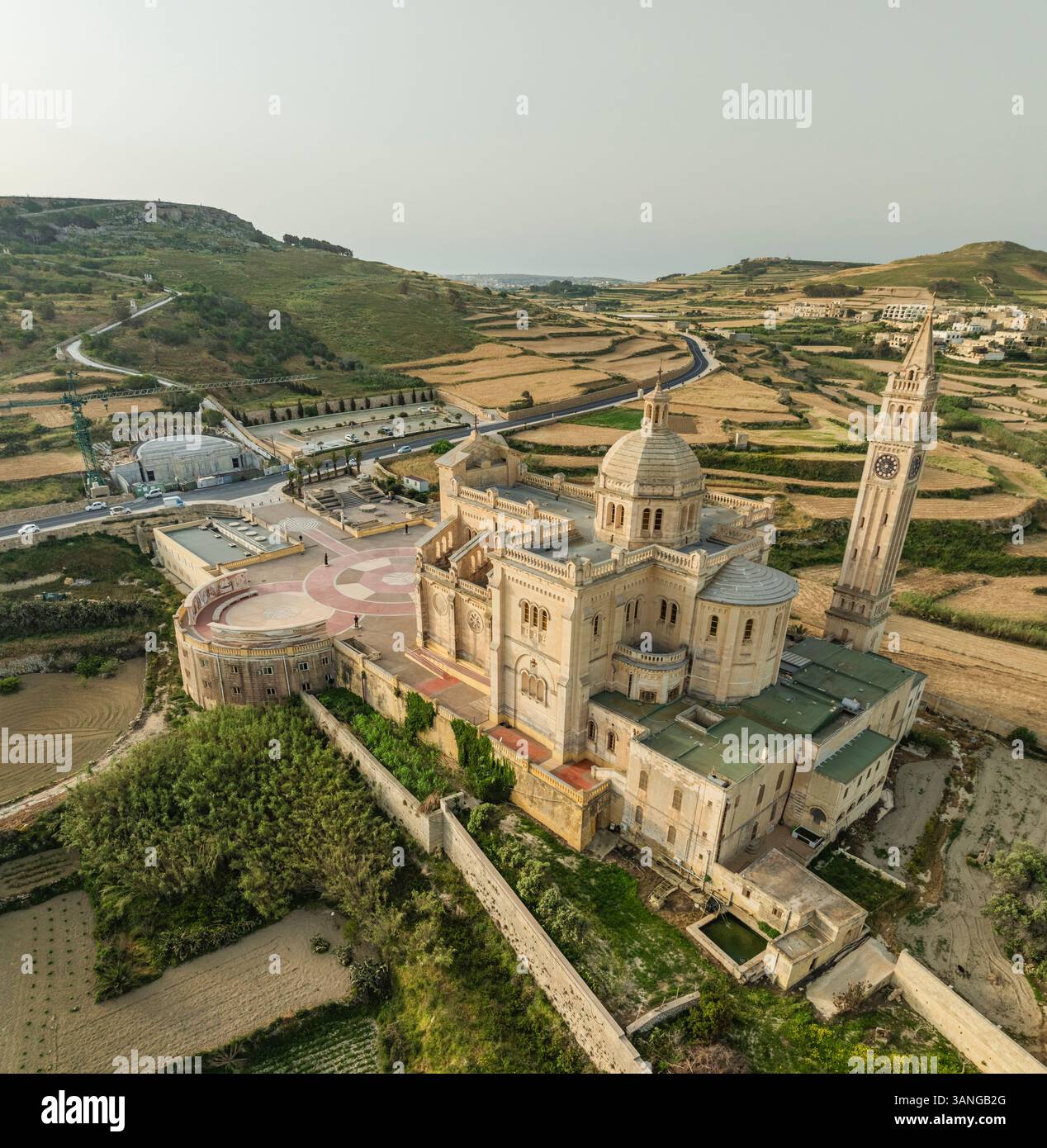 Aerial view of Basilica Tal-Madonna Ta' Pinu surrounded by greenery and ...