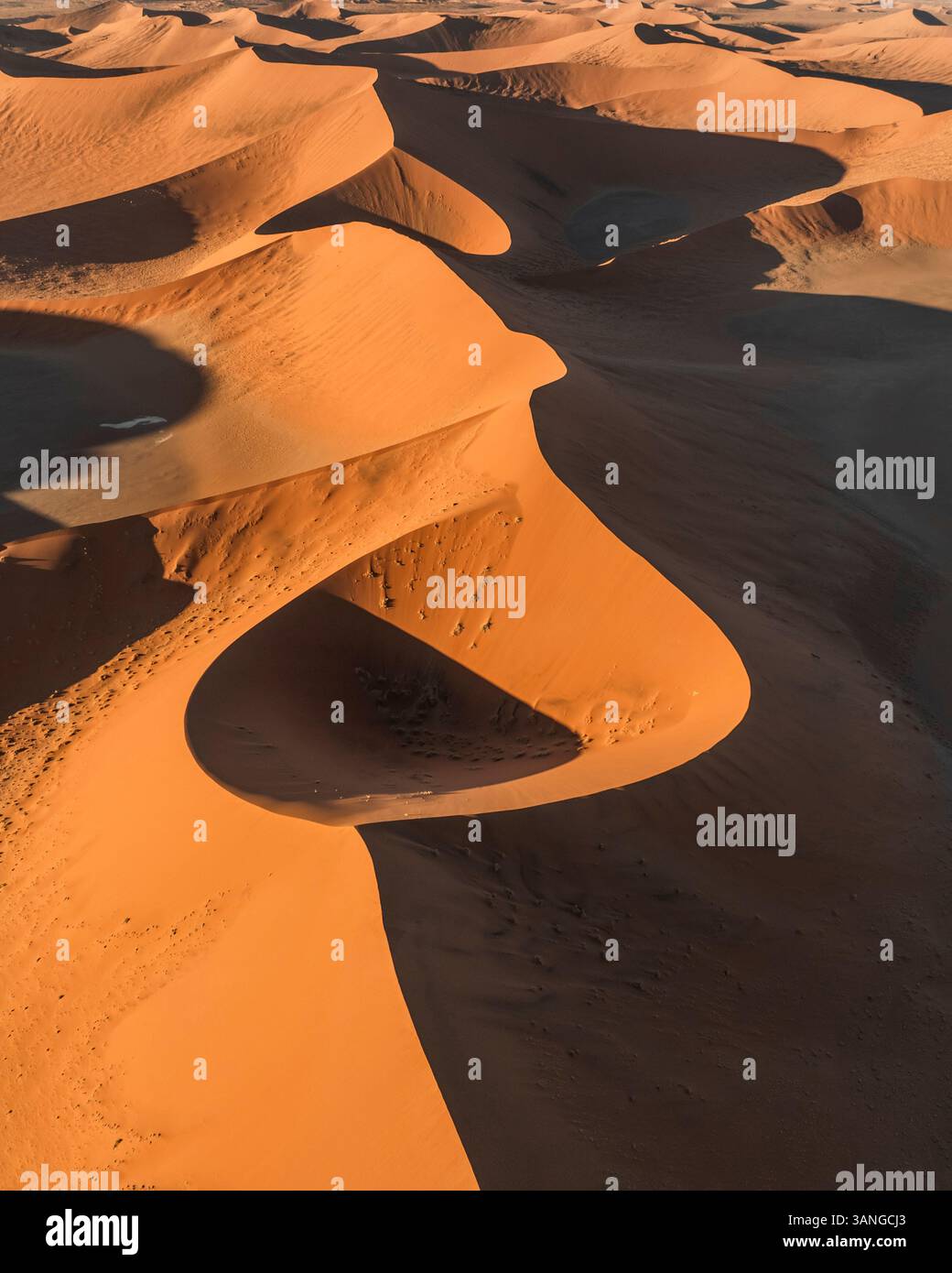 Aerial view of sandy desert landscape with beautiful patterns and ...