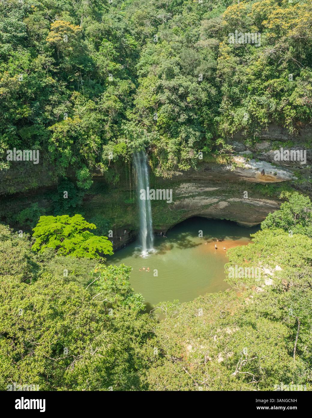 Aerial view of lush forest and La Esmeralda Waterfall, Mesetas, Meta ...