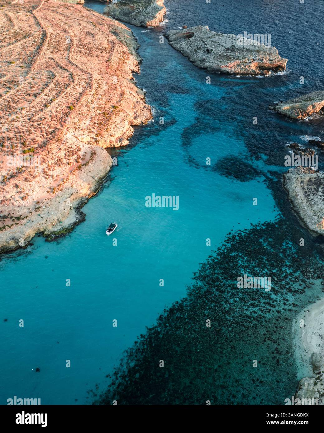 Aerial view of rugged coastline with turquoise waters, Gozo, Comino ...