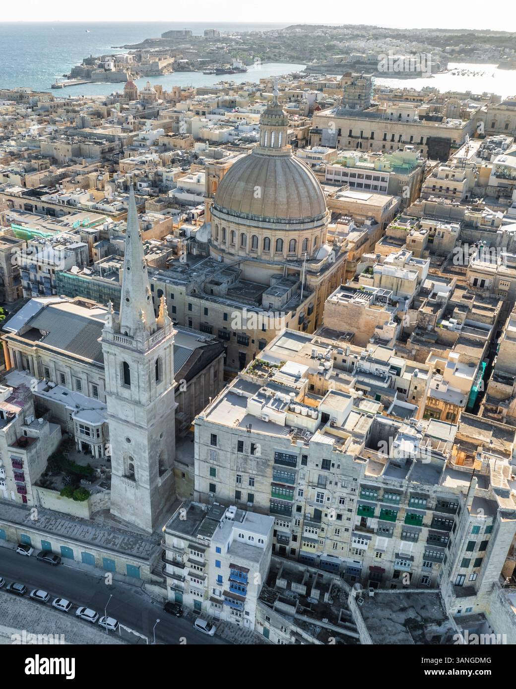 Aerial view of historic coastal town with medieval architecture along ...