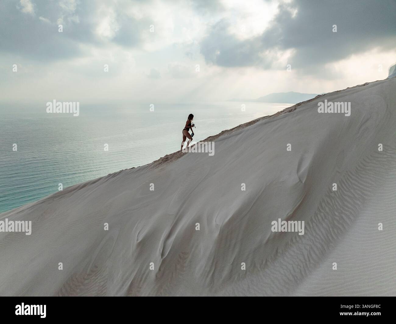 Aerial view of Arher sand dune with woman, Socotra, Yemen Stock Photo ...