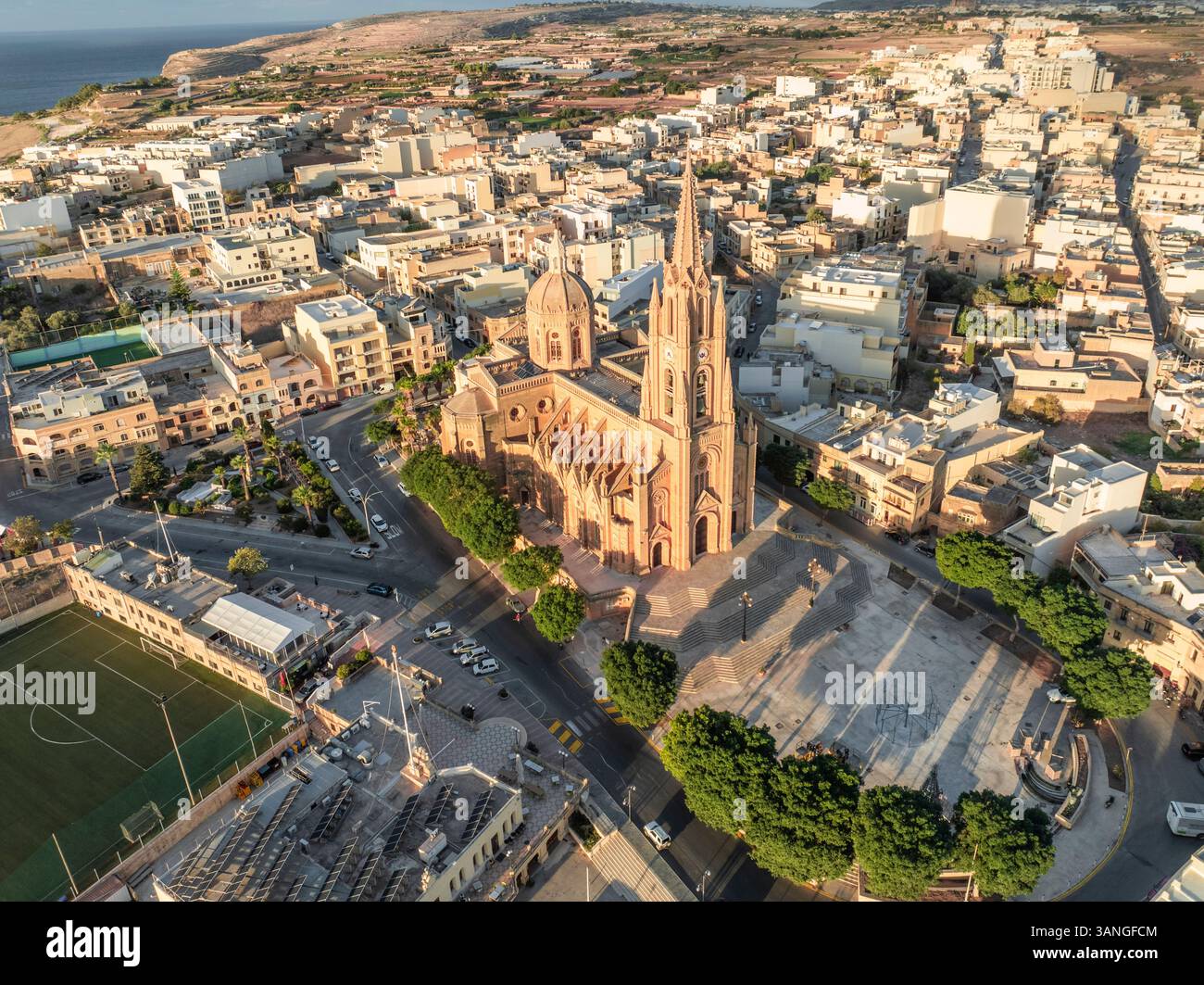 Aerial view of historic Ghajnsielem Parish church by the Mediterranean ...