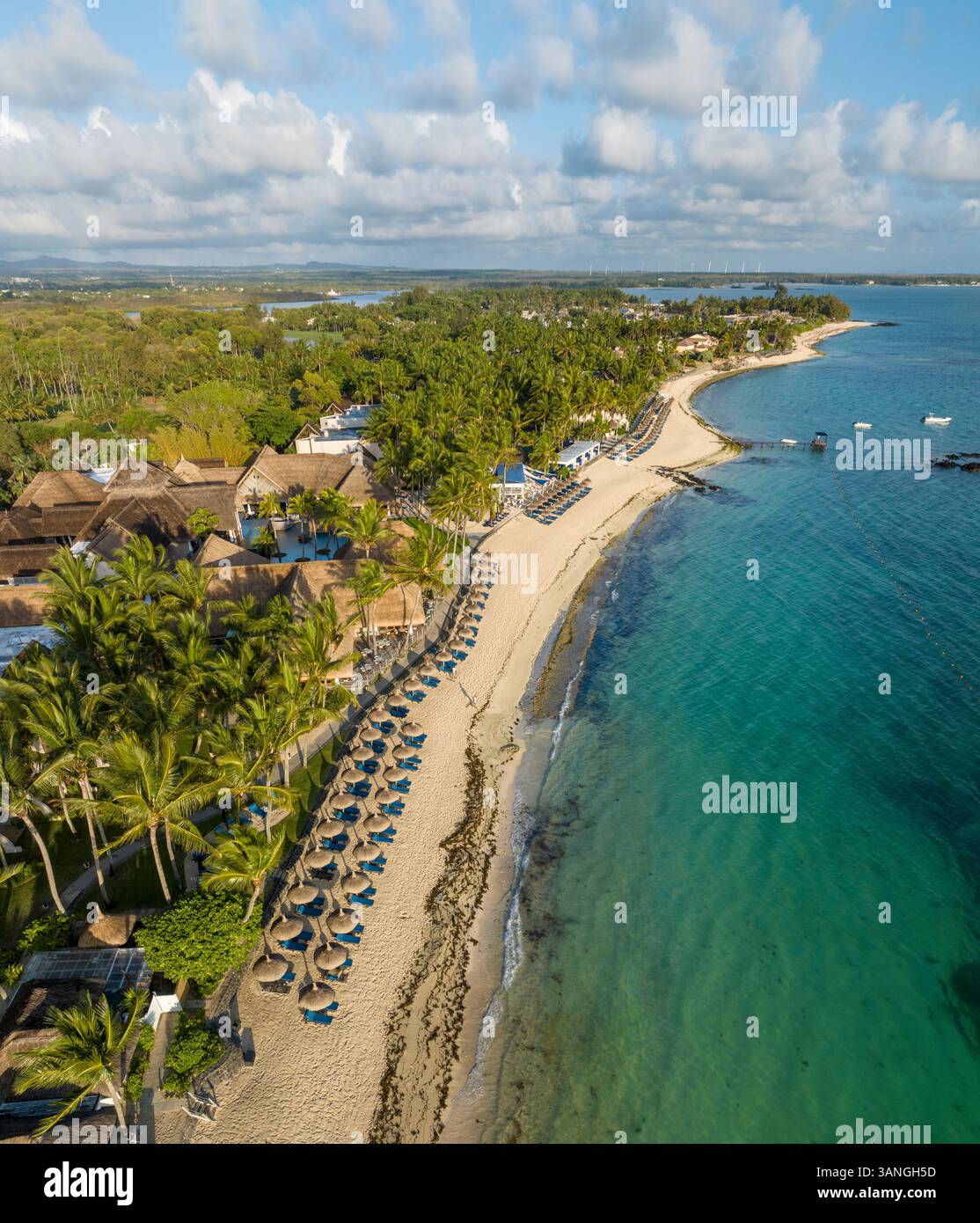Aerial view of Constance resort on a beautiful tropical beach with palm ...
