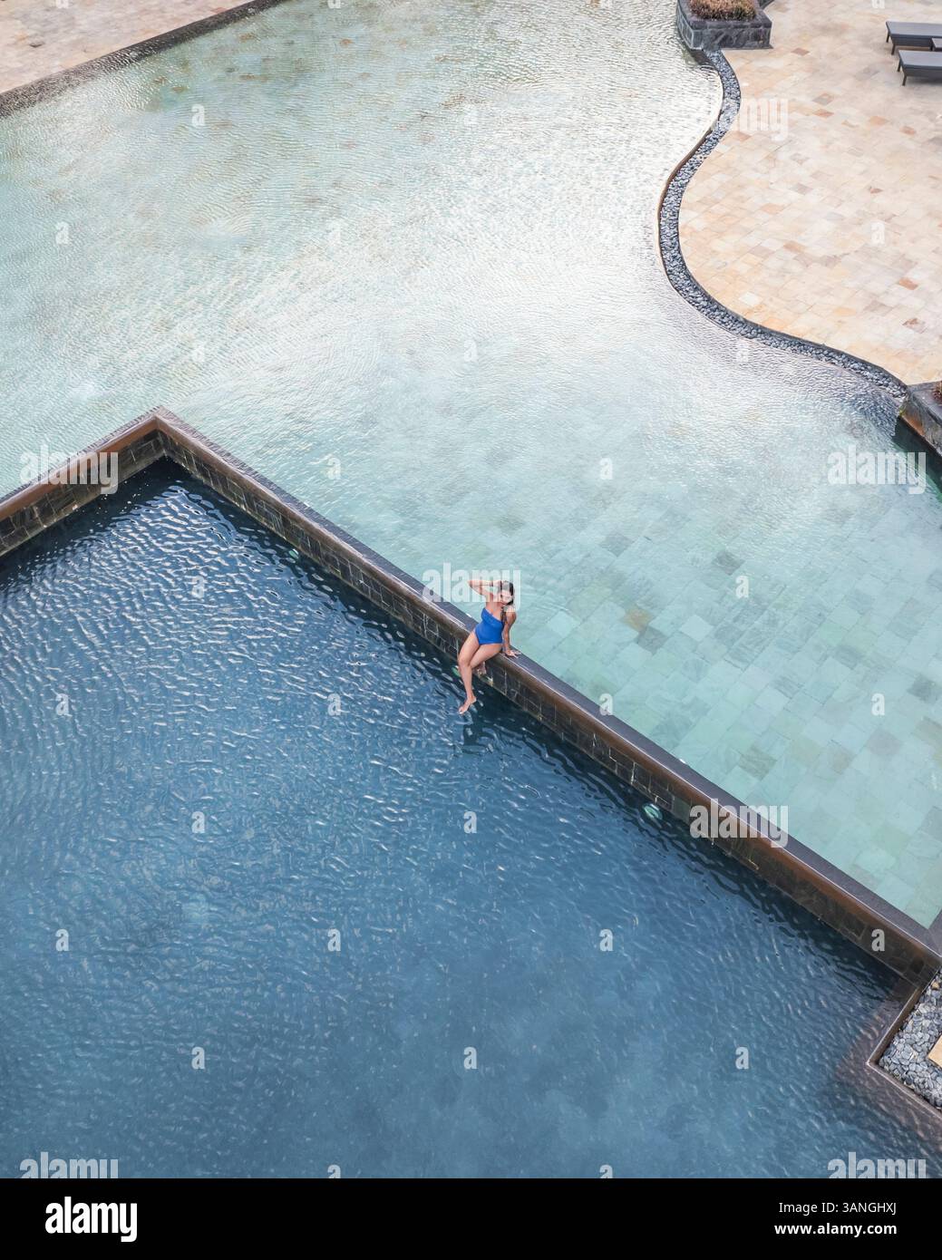 Aerial view of Anahita luxury resort with people sunbathing by the ...