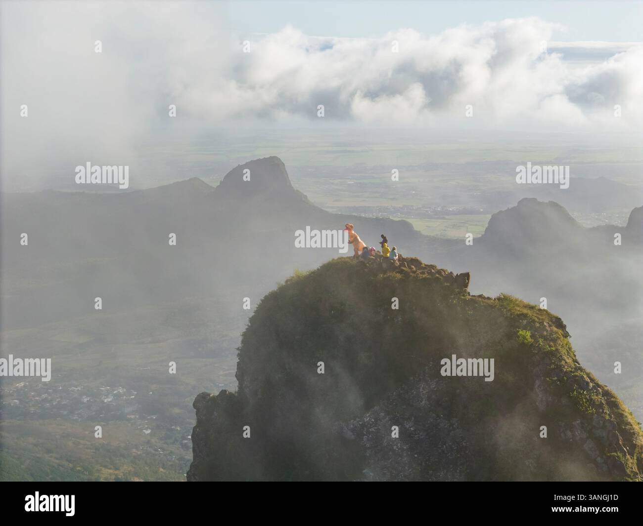 Aerial view of Le Pouce mountain with hikers and fog, Moka, Mauritius ...