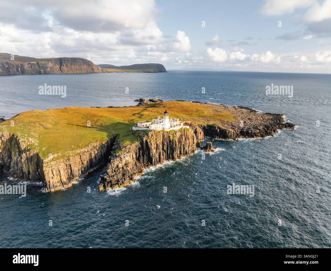 Aerial view of Neist Point Lighthouse on the edge of the Atlantic Ocean ...