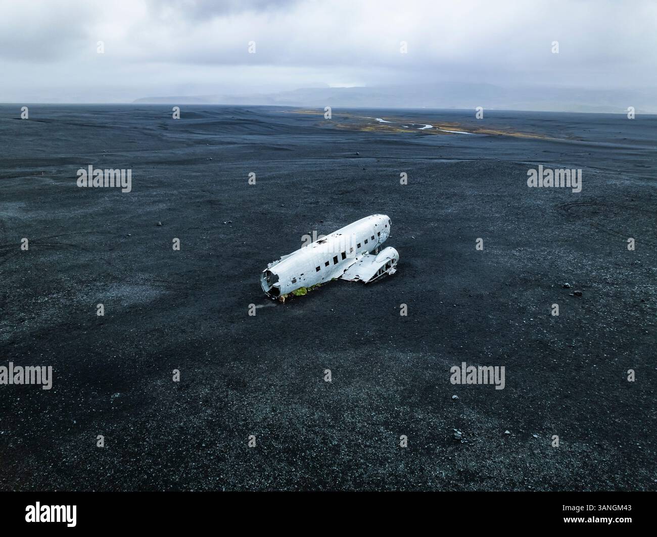 Aerial view of plane wreckage on black sandy beach, Vik i Myrdal ...