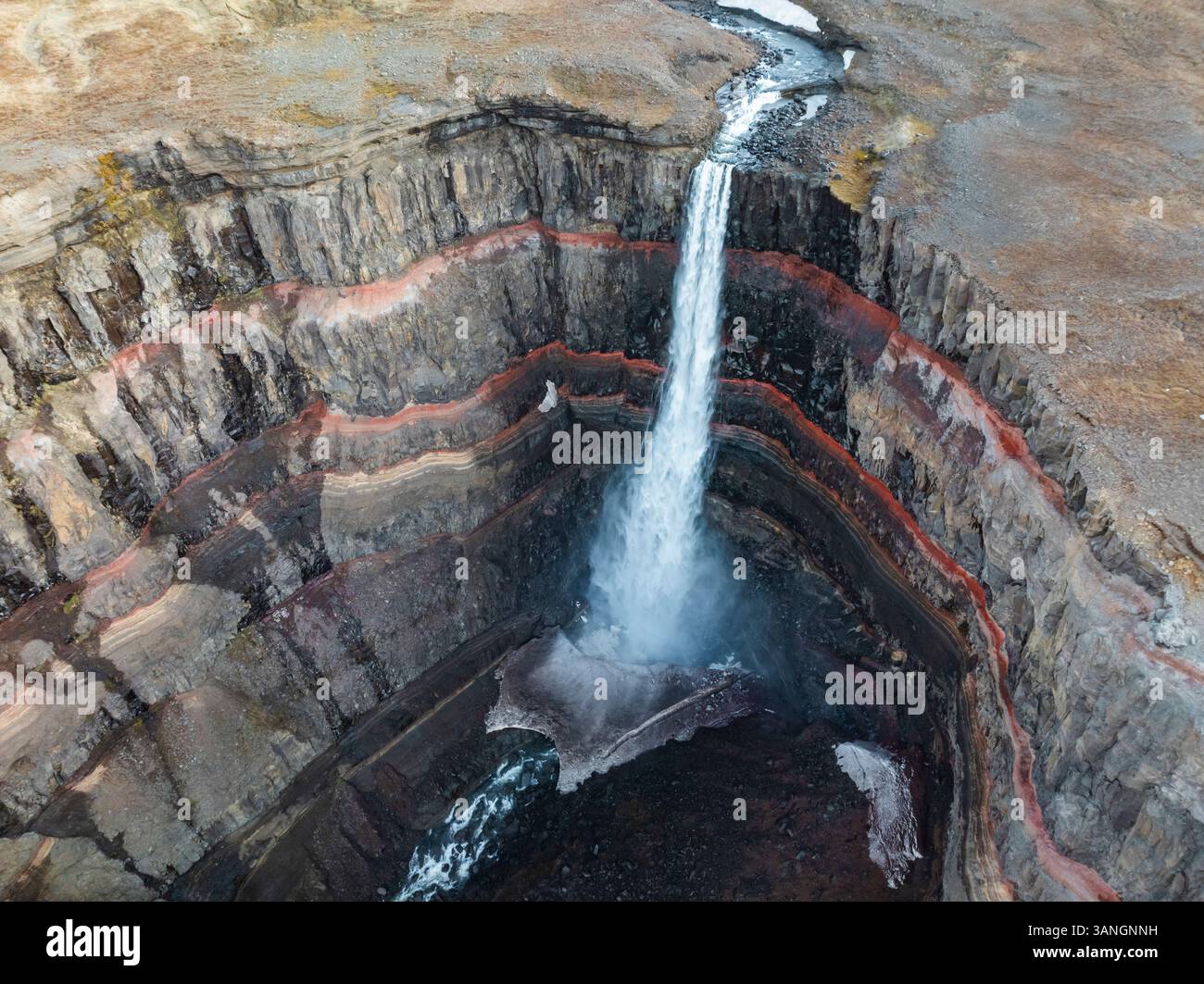 Aerial view of Hengifoss, waterfall, with volcanic splendor and ...