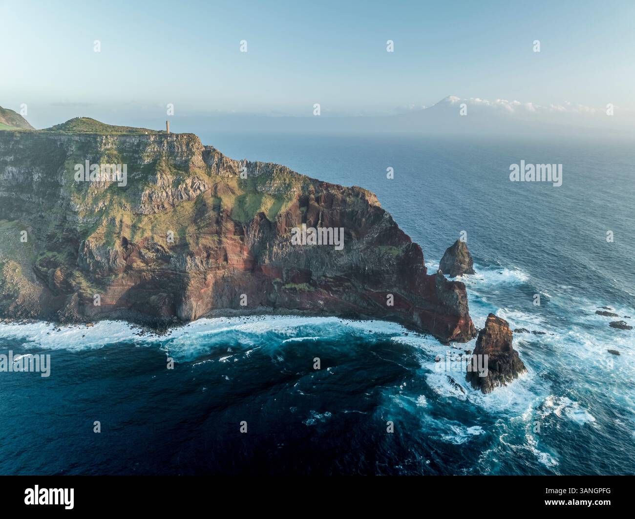 Aerial view of Sao Jorge Island with Farol dos Rosais lighthouse ...