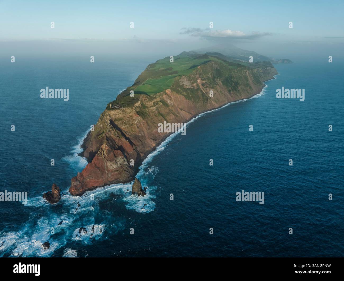 Aerial view of Sao Jorge Island with Farol dos Rosais lighthouse ...