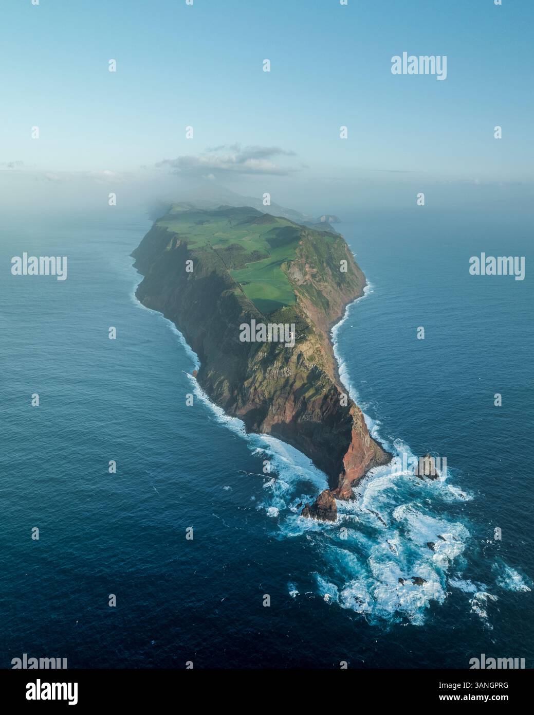 Aerial view of Sao Jorge Island with Farol dos Rosais lighthouse ...