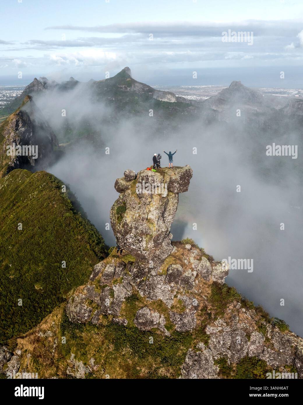 Aerial view of people on the top of the Pieter Both mountain peak ...