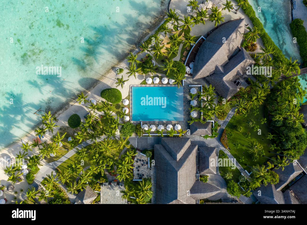 Aerial view of wooden huts from a luxury hotel along the reef in Tahiti ...