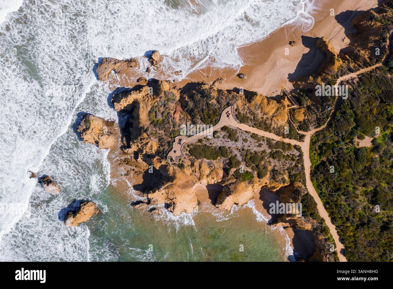 Aerial view of a wooden walkway at the shore of the beach, Torquay, Jan ...