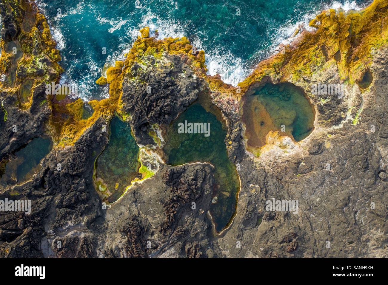 Aerial View of Piscinas Naturais Caneiros rock pool, on the cliff along ...