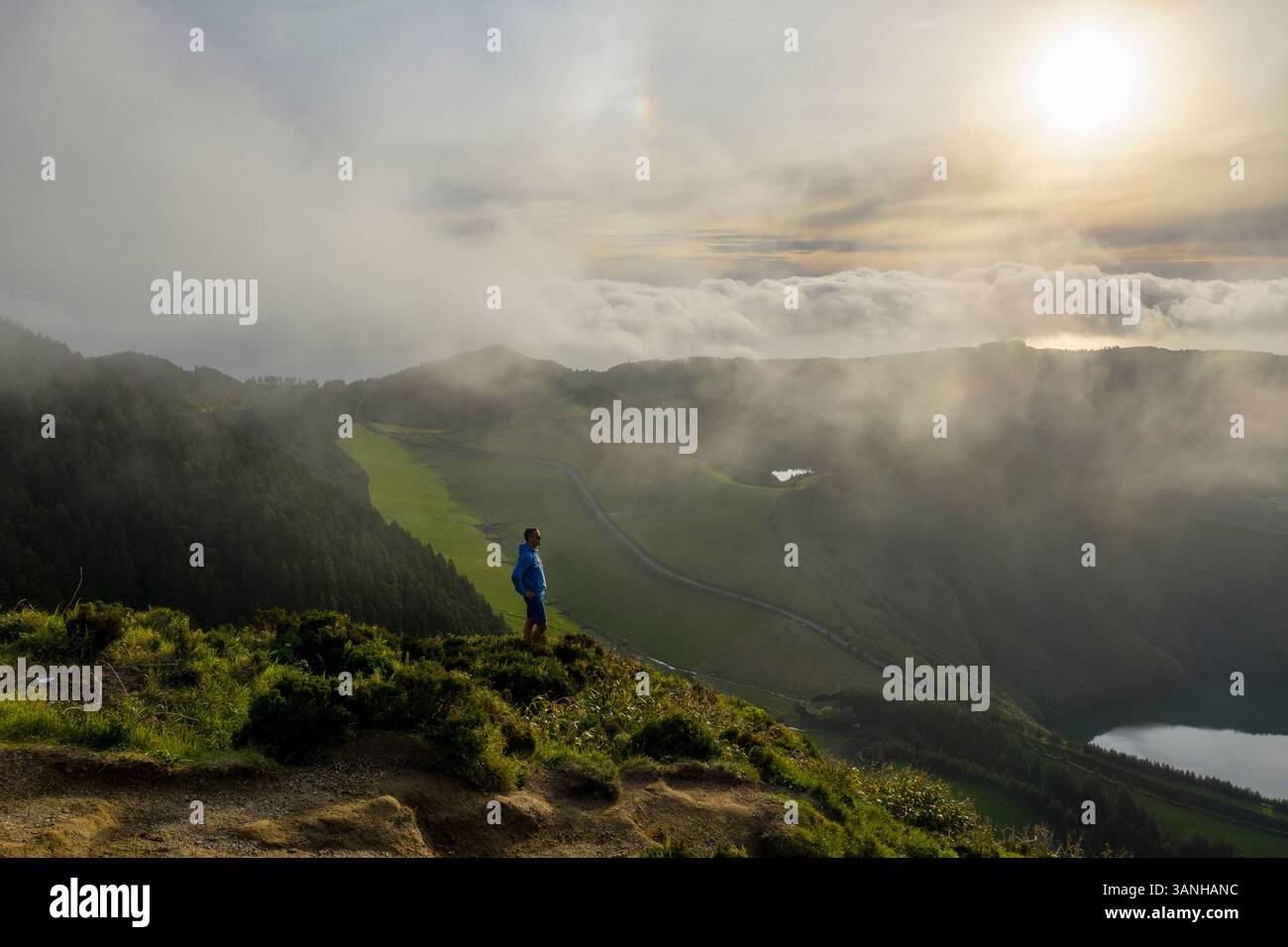 Aerial View of person on the top of the mountain watching Lagoa de ...