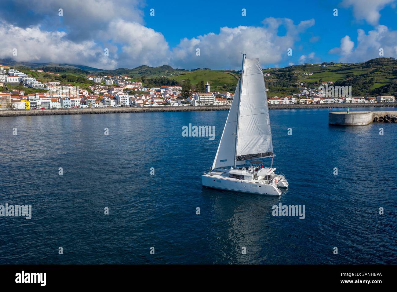 Aerial view of a catamaran sailing near Horta harbor on Faial Island ...