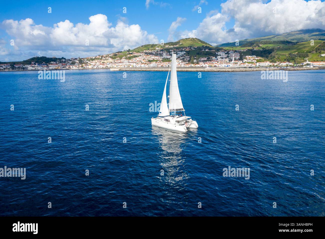 Aerial view of a catamaran sailing near Horta harbor on Faial Island ...